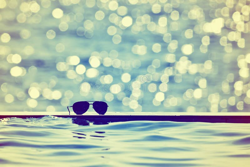 Sunglasses by the Pool. Retro Style. Summer Background. Stock Photo ...