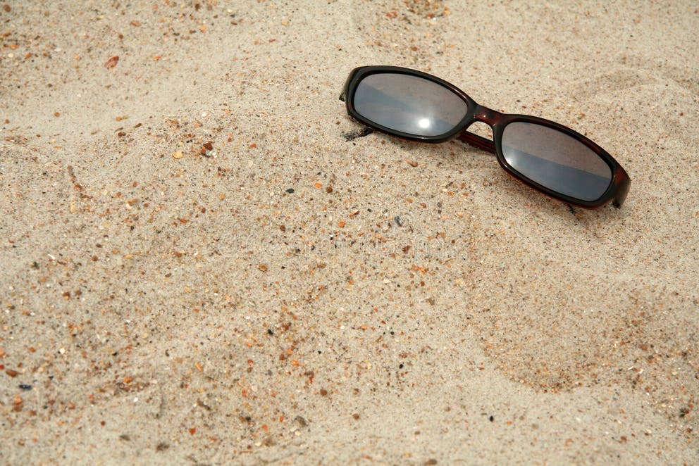 Sunglasses in the sand stock image. Image of relaxation - 815421