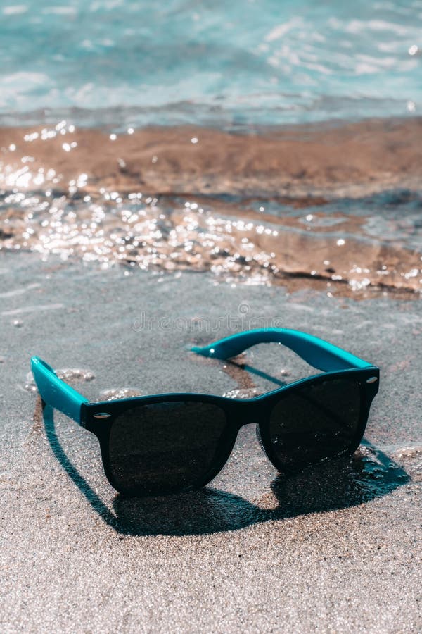 Sunglasses Sand by the Sea. Concept Beach Holiday. Stock Photo - Image of accessories, concept ...