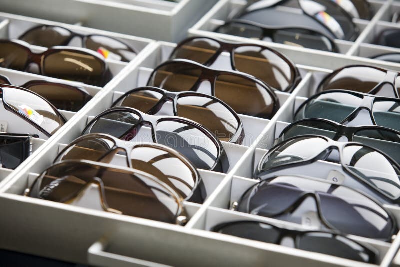 Racks of Sunglasses on Display in an Eyewear Store. Stock Photo - Image ...