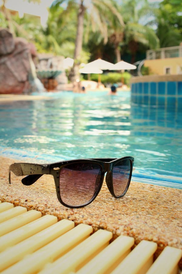 Sunglasses at the Swimming Pool of the Hotel. Stock Image - Image of ...