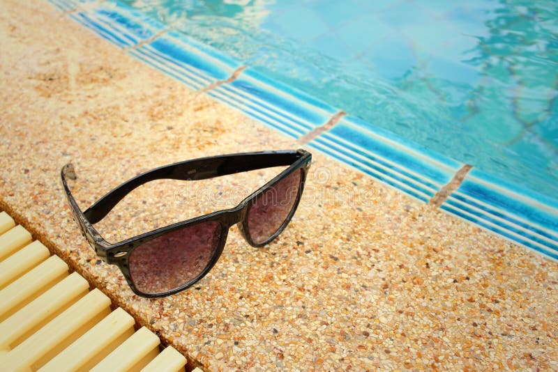 Sunglasses at the Swimming Pool of the Hotel. Stock Image - Image of ...