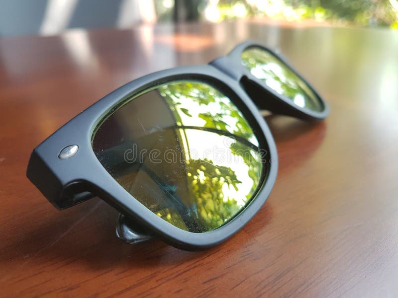 Sunglasses on the table. stock photo. Image of mirror - 89355492