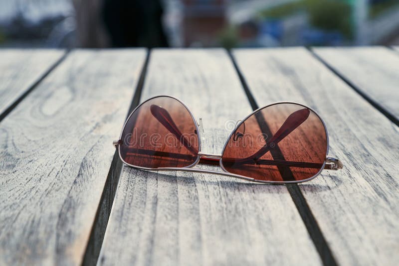 Sunglasses on a table stock photo. Image of desk, urban - 236821770