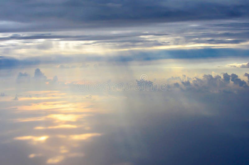 Sunlight Beams through Dramatic Cloud Layers during Peaceful Sunrise ...