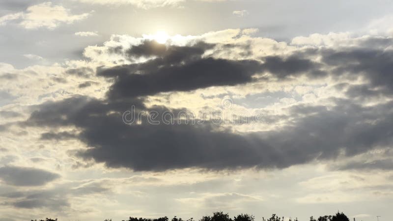 Sunlight Breaking through Cumulus Cloud at Sunset. Sun Going Down ...
