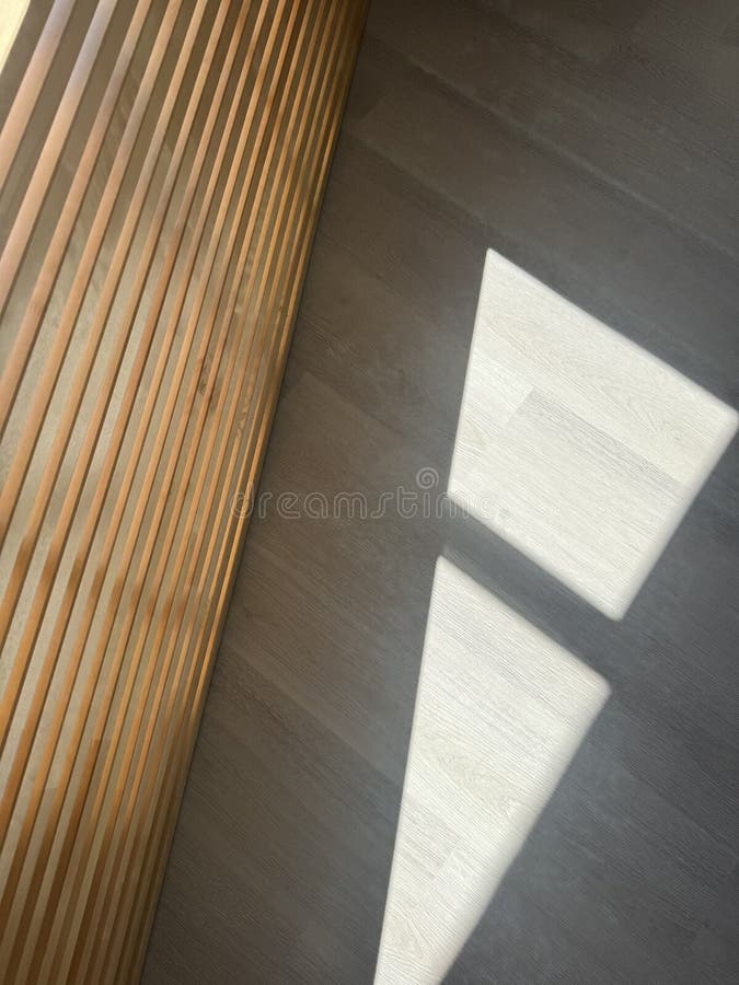 Sunlight Casting Geometric Shadows on Wooden Slats in a Modern Interior ...