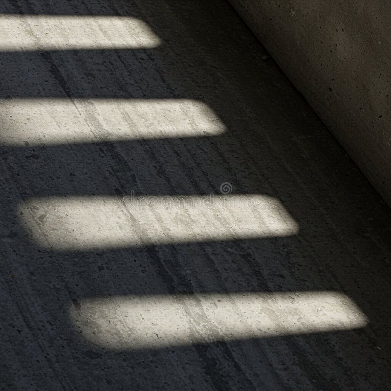Sunlight Casts Rectangular Shadows on a Textured Concrete Surface. the ...