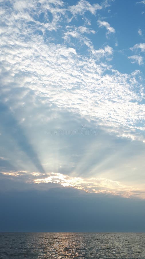 Sunlight through the Clouds Over the Sea Stock Image - Image of clouds ...