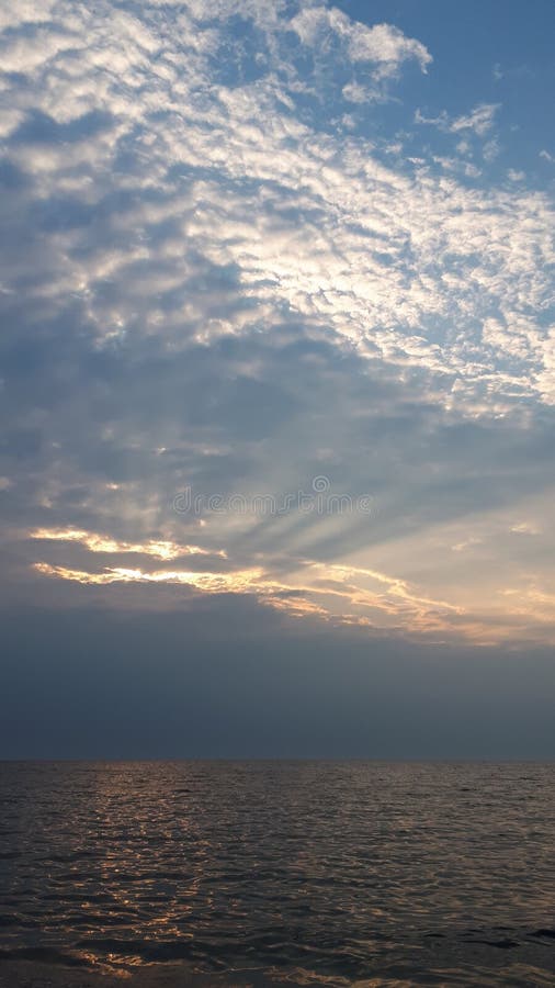 Sunlight through the Clouds Over the Sea Stock Photo - Image of clouds ...