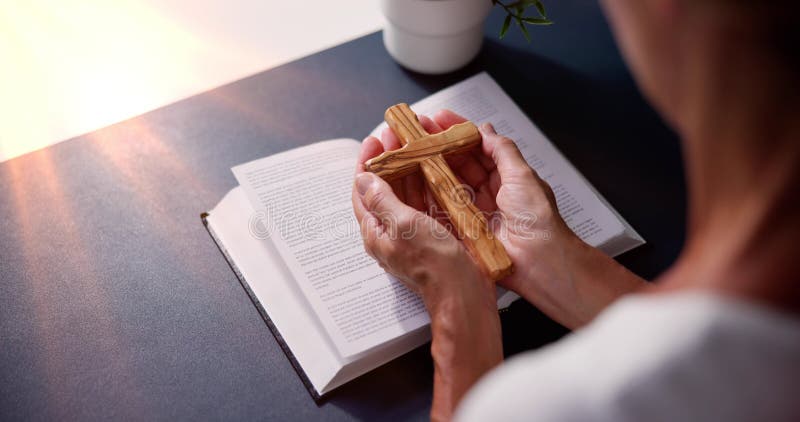 Sunlight Falling on Hand Over Bible Stock Image - Image of praying ...
