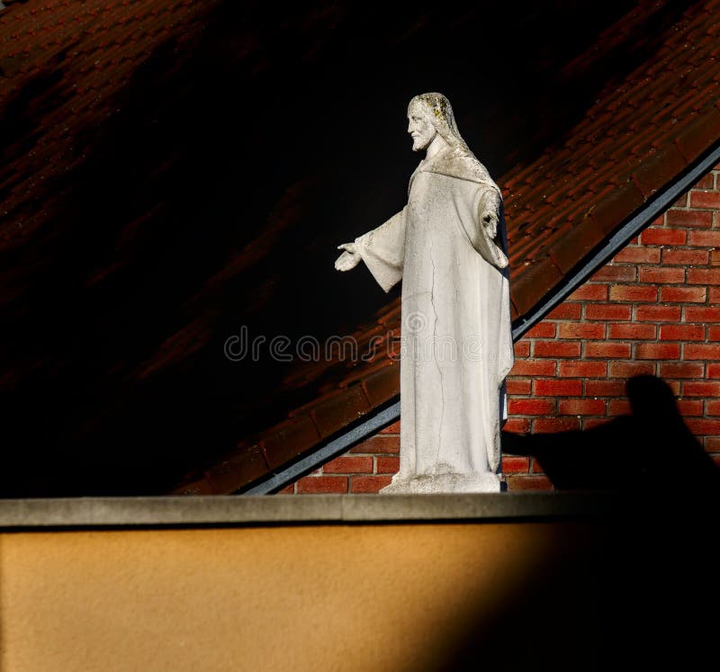 Sunlight Falling on the Statue of Jesus Christ with Brick Walls in the ...