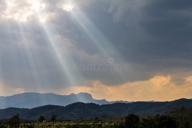 The Sunlight To Pass through between the Clouds Down the Ground. Stock ...