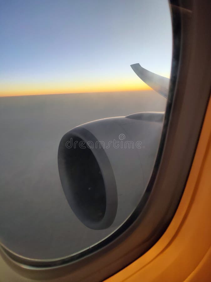 Sunlight on the Horizon from Inside the Plane Stock Photo - Image of ...