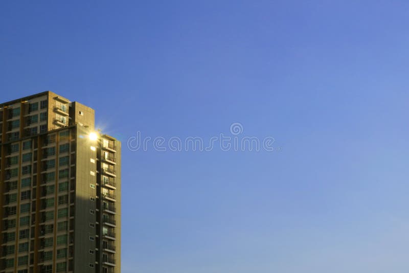 Sunlight Reflecting on a Modern Building with Blue Clear Sky in the ...