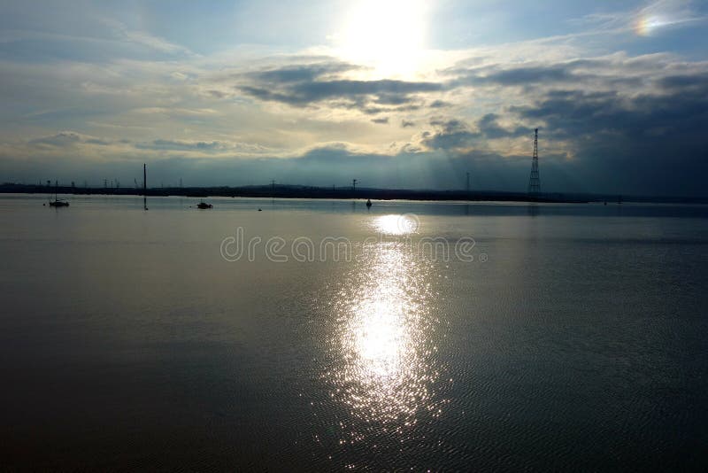 Sunlight Reflecting on a River Stock Image - Image of ocean, clouds ...
