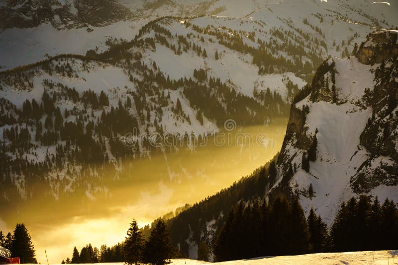 Sunlight Reflecting through Valley Mist in the Mountains Stock Photo ...