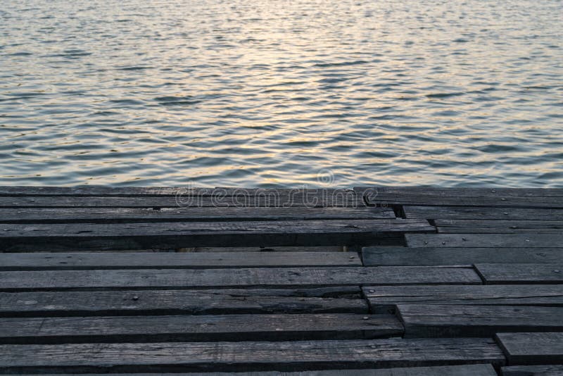 Sunlight Reflection in Lake with Wood Floor Stock Image - Image of lake ...