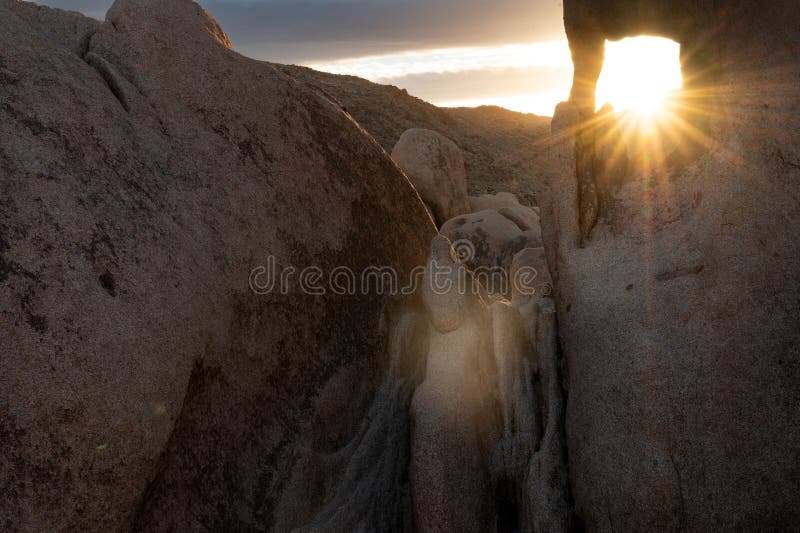 Sunlight through Rock Formations at Sunset Stock Image - Image of ...