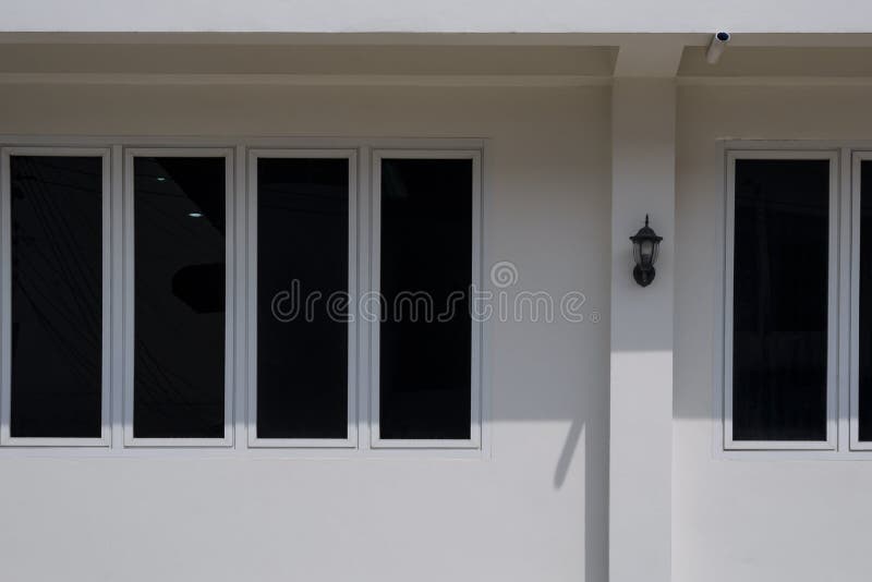 Sunlight and Shadow on Glass Windows Surface Outside of House Building ...