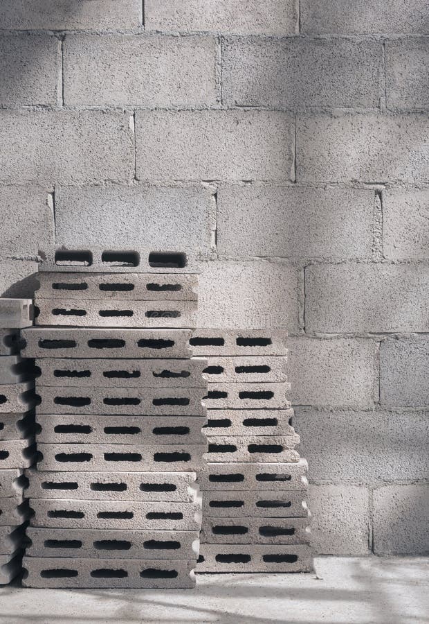Sunlight and Shadow on Stack of Concrete Blocks Near Brick Block Wall ...