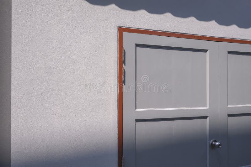 Sunlight and Shadow on Surface of Wooden Door on Gray Cement Wall of ...