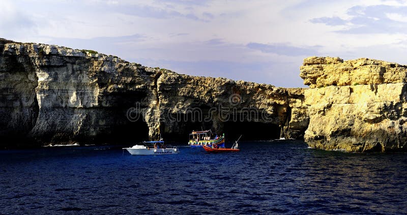 Sunlight on Smugglers Cave and Cliffs Editorial Image - Image of ocean ...