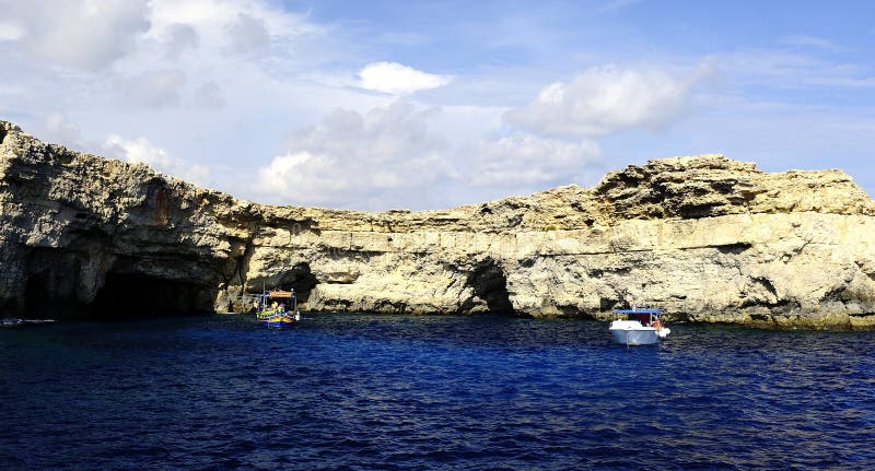 Sunlight on Smugglers Cave and Cliffs Editorial Photo - Image of ...