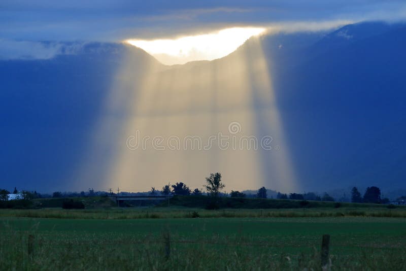 Sunlight Streaming through Cloud at Daybreak Stock Photo - Image of ...