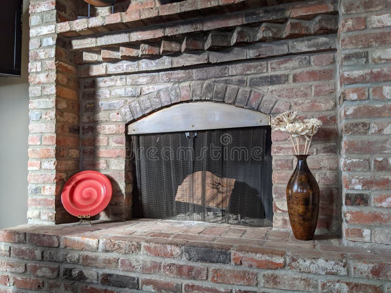 Sunlight Streaming in on a Wood Burning, Brick Fireplace, Surrounded by ...