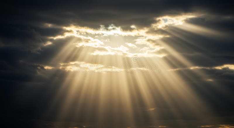 Sunlight Streams through Gaps in Dark, Dense Clouds, Creating Striking ...