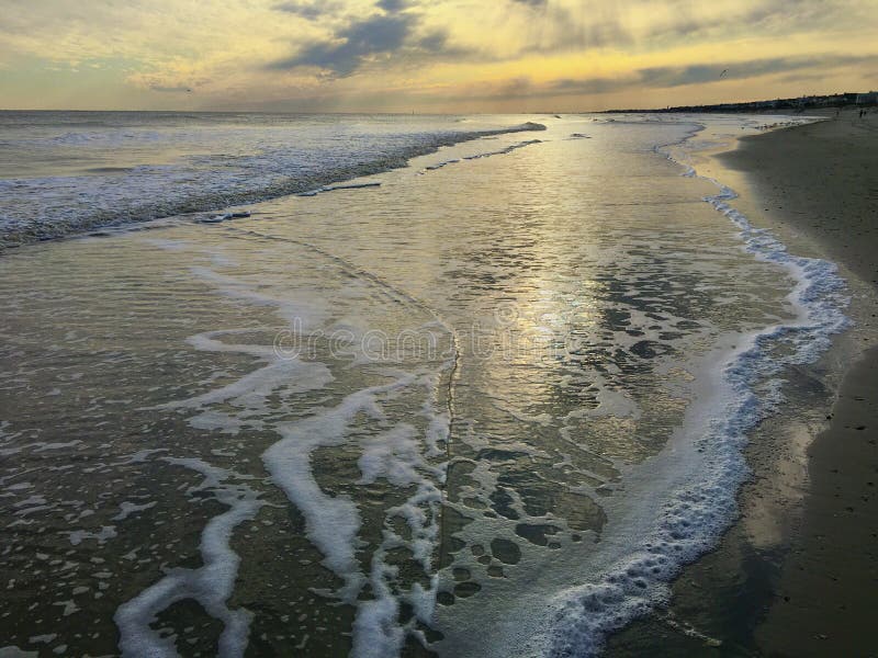Sea waves and sandy beach stock photo. Image of clear - 146973152
