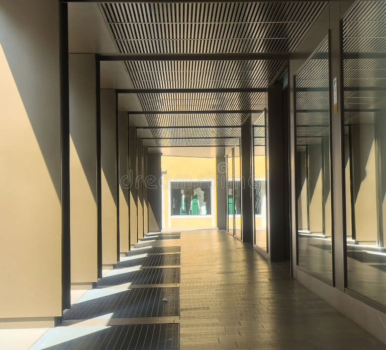 Sunlit Modern Architectural Corridor with Geometric Shadows Editorial ...