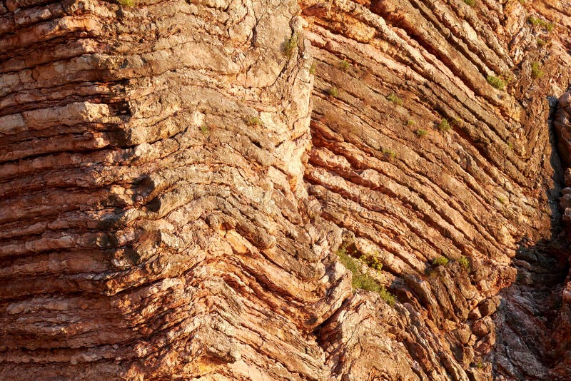 Sunlit Rock Cut with Lines and Rows Stock Photo - Image of layered ...
