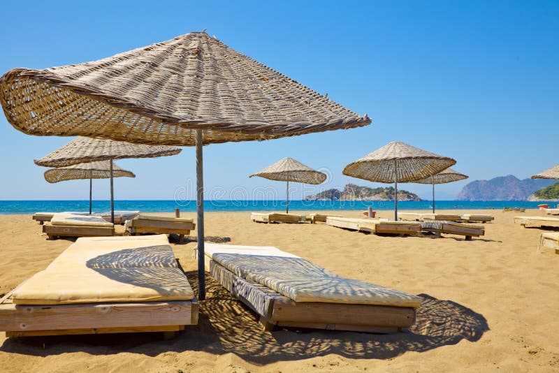 Sunny beach stock image. Image of seacoast, empty, chaise - 21337235