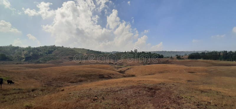 A Sunny Bright Day and Village Scene Stock Image - Image of hill, cloud ...