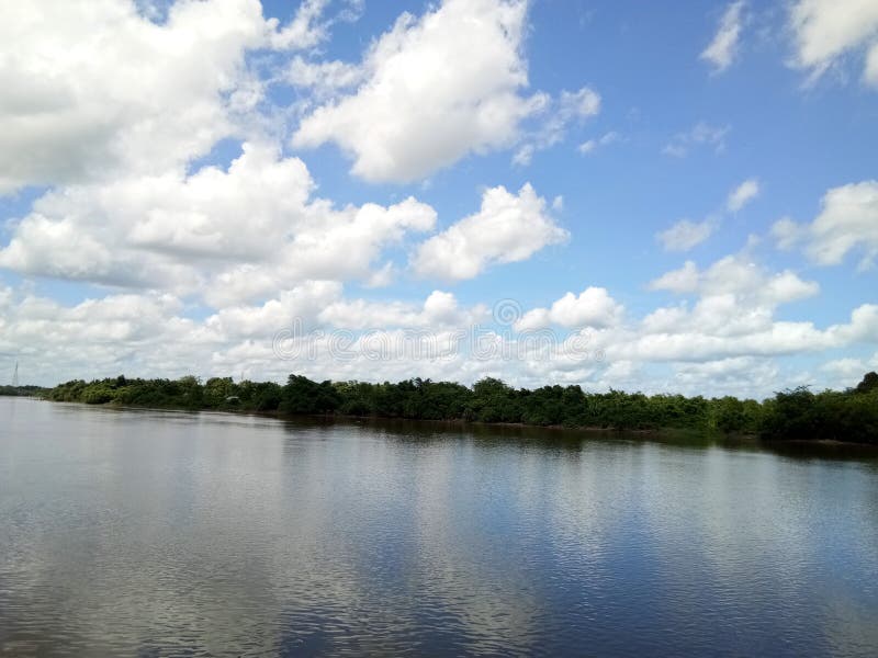 Sunny Day with Beautiful Clouds and Stretching River Stock Photo ...