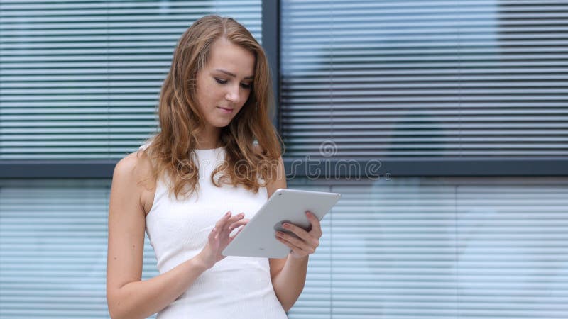 Sunny Day, Girl Standing and Browsing on Tablet Stock Photo - Image of ...