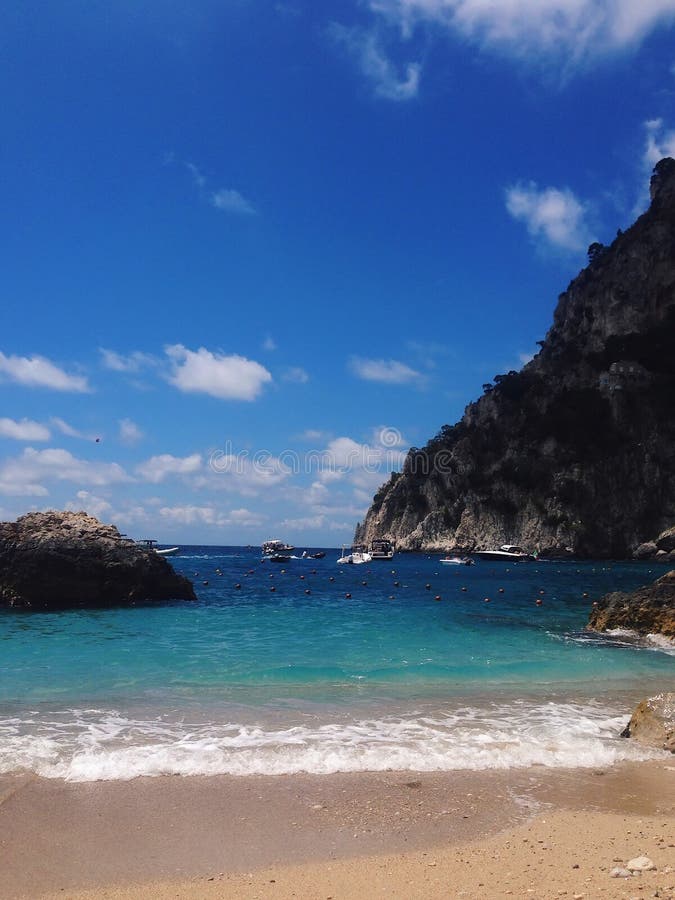 Sunny day by the sea stock image. Image of coastline - 179304655