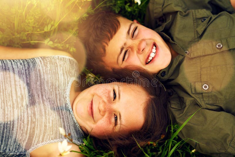On Sunny Days, we Want To Be Outside. Two Cute Siblings Lying Side by ...