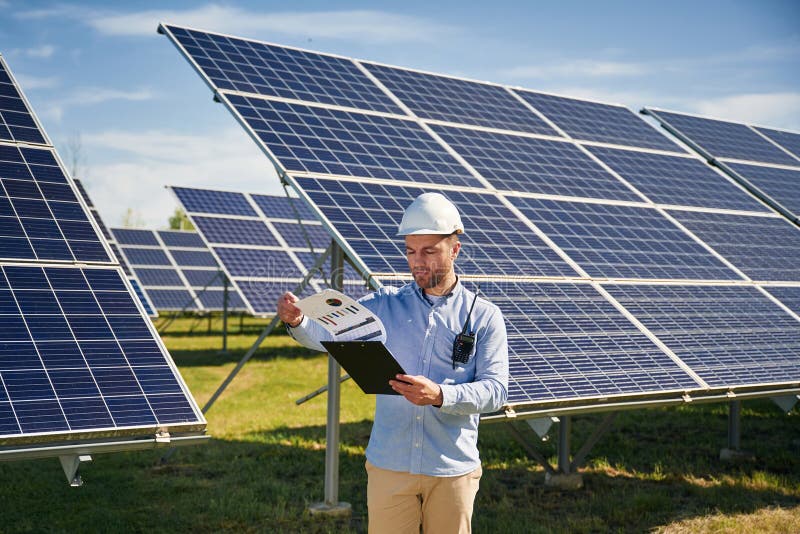 Sunny Daytime. Engineer with Photovoltaic Solar Panels Outdoors Stock ...