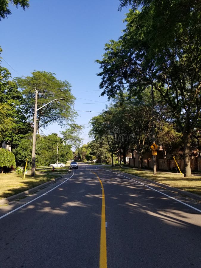 Sunny Evening Stroll stock image. Image of street, park - 252207445