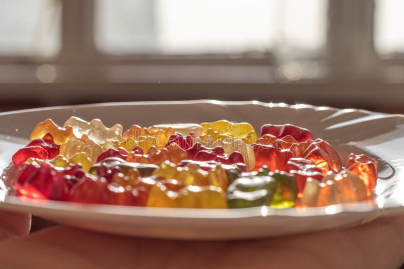 Sunny Jelly Bears on White Plate Side View Editorial Photo - Image of ...