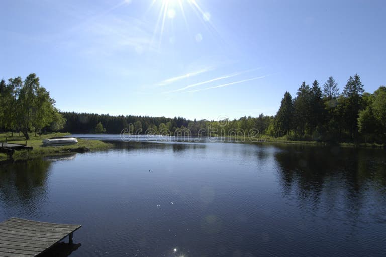 Sunny Lake with Boat Ramp stock photo. Image of blue, calm - 5506574