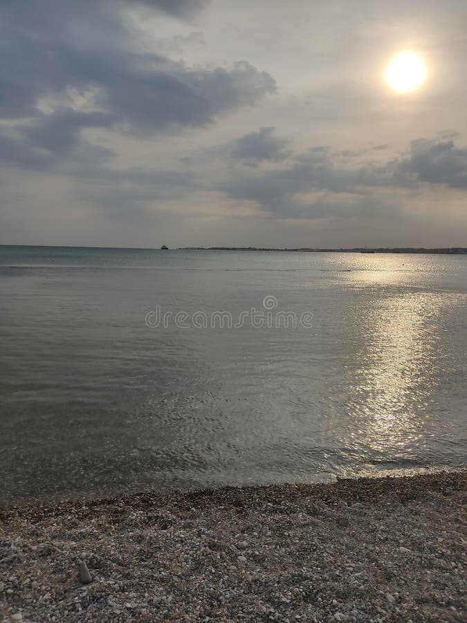 A sunny path at sunset stock photo. Image of reflection - 234240186