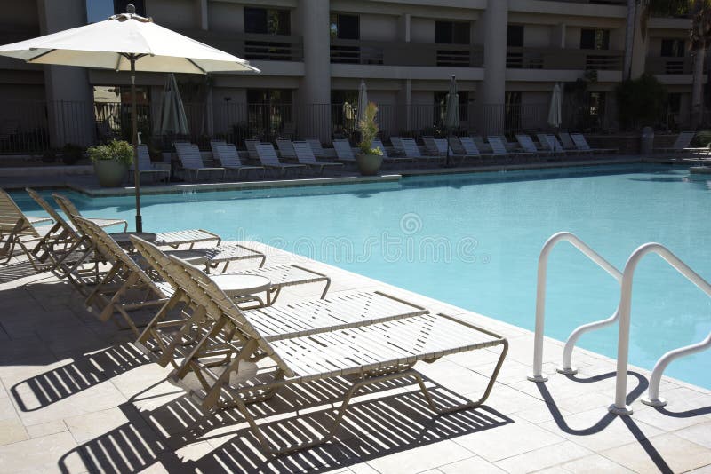 Sunny Poolside Waiting for Guests Stock Photo - Image of shadows ...