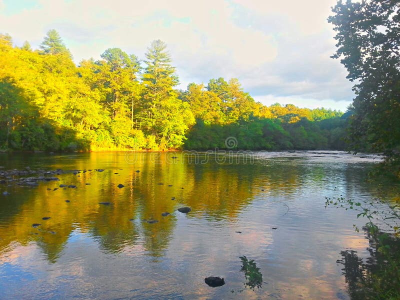 Sunny River Embankment, Railway Bridge and Snow-capped Mountains on the ...