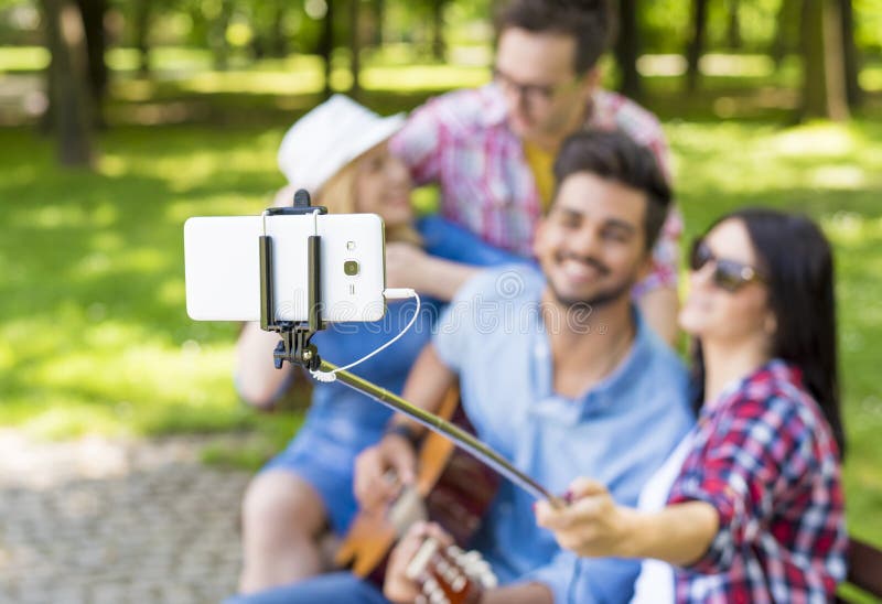 Sunny Scenery of a Group of Young Friend Having Fun in a Park Stock ...