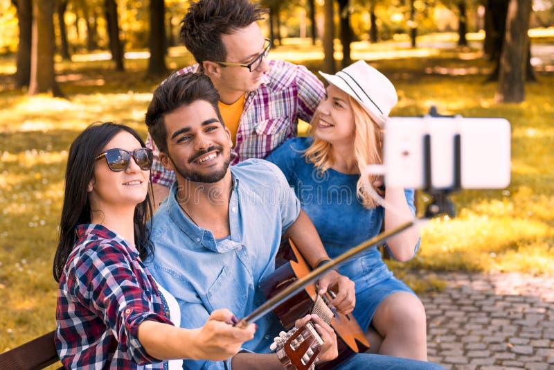 Sunny Scenery of a Group of Young Friend Having Fun in a Park Stock ...