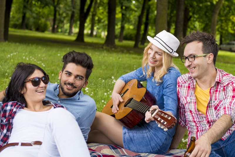 Sunny Scenery of a Group of Young Friend Having Fun in a Park Stock ...